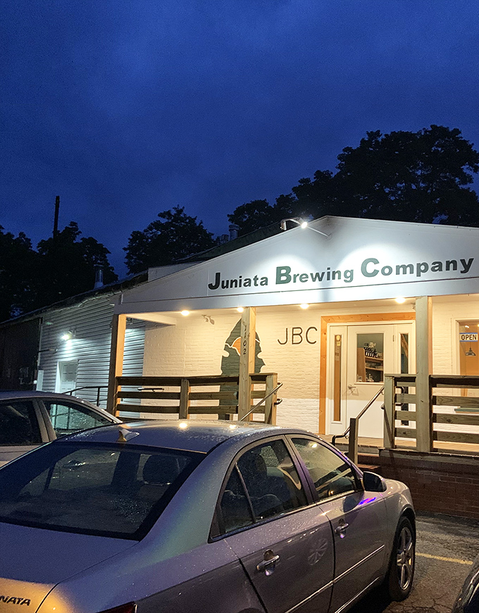 Juniata Brewing Company glows like a beacon for thirsty travelers, promising craft beers that taste like they were made by someone who knows your name.