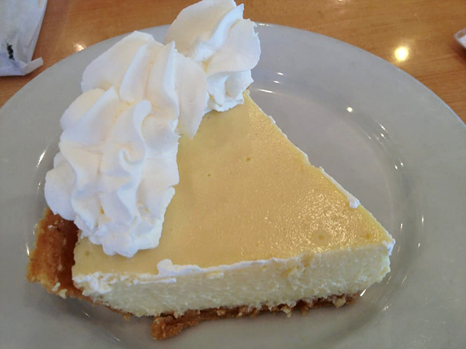 Key lime pie that captures Florida sunshine in every bite. That cloud of whipped cream isn't garnish&mdash;it's the perfect counterpoint to citrus tang.