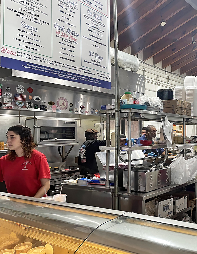 The kitchen crew orchestrates a seafood symphony while you wait. Their red shirts might as well say "Guardians of the Gulf."