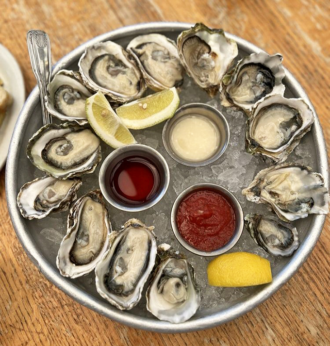 Oysters arranged like a clock face, suggesting it's always time for something briny, fresh, and utterly magnificent.