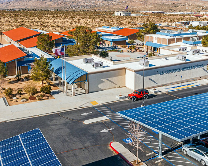 Education with a view! La Contenta Middle School's solar-covered parking shows Yucca Valley's commitment to both future generations and sustainable desert living.