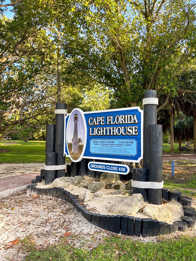 The sign announces operating hours with nautical flair, using wooden posts and rope that would make any pirate feel right at home.