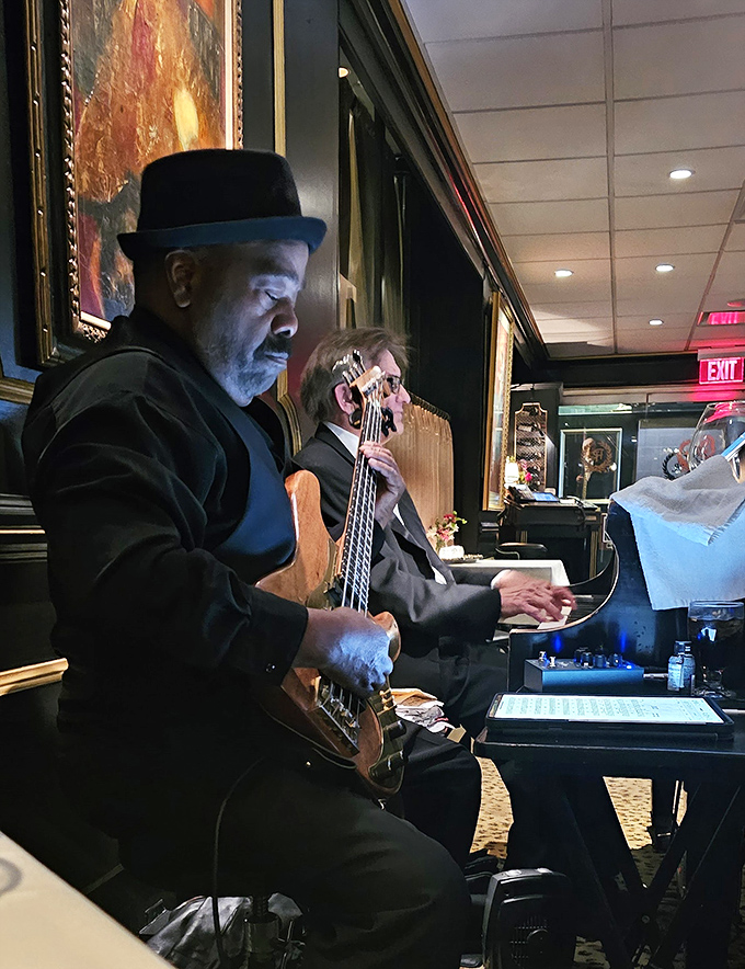 Live music elevates dinner to an experience. The soulful notes from this bassist's skilled hands provide the perfect soundtrack to your culinary journey through carnivore country.