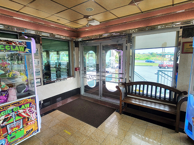 The entrance area &ndash; half nostalgic time portal, half promise of good things to come, with a claw machine that's seen more quarters than a laundromat.