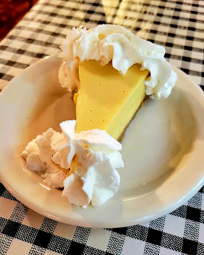 Key Lime Pie that strikes the perfect balance between sweet and tart &ndash; a slice of Florida sunshine topped with clouds of whipped cream.