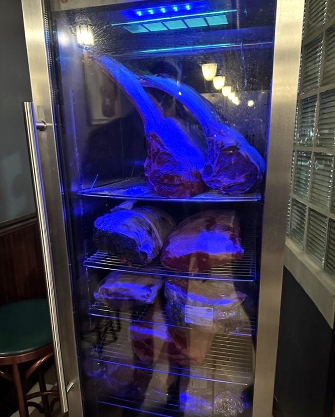 The dry-aging cabinet glows like a jewelry case, except these gems are marbled and meant for your plate. Patience transforms good meat into greatness here.