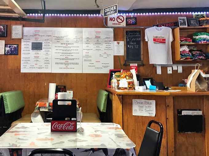 Order at the counter, where the menu board tells no lies and the merch reminds you to take a piece of burger paradise home.