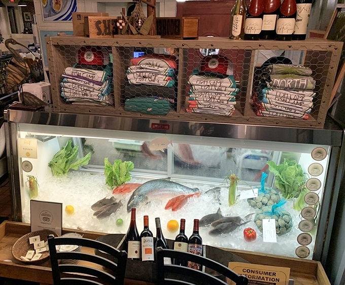 Merchandise that lets you take home the Fish Camp spirit, if not the actual fish&mdash;displayed above the day's catch on ice. 