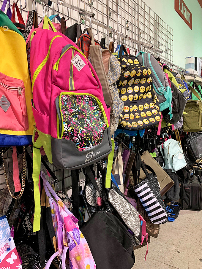 Backpack heaven for budget-conscious parents. That emoji-covered bag probably belonged to a teen who's now explaining TikTok to their college roommates. 