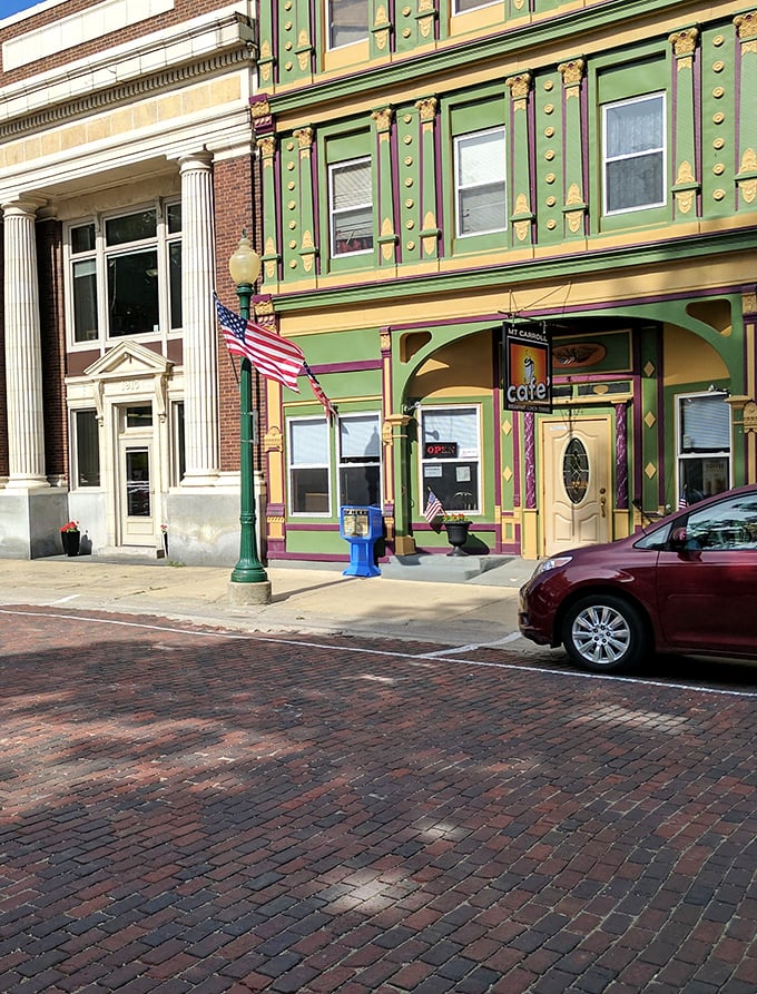 Mount Carroll Caf&eacute;'s vibrant green and gold fa&ccedil;ade brings unexpected whimsy to the brick streetscape&mdash;like finding a peacock among pigeons.