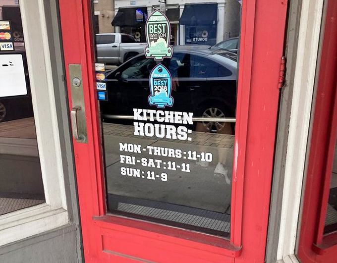 Kitchen hours posted prominently&mdash;because knowing when you can get your cod fix is essential information for planning your week.