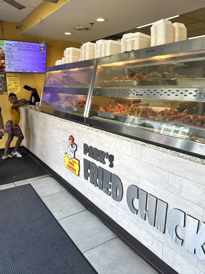 Where chicken dreams come true. The gleaming display case showcases today's batch of golden-brown treasures waiting for their forever homes.