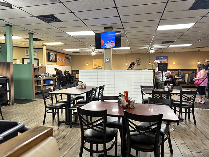 The warm glow of pendant lights illuminates tables where memories are made over shared meals and laughter.