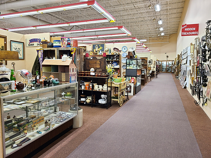 The mall's wide aisles invite exploration with "Hidden Treasures" signs pointing the way. Each booth is a self-contained world of collectibles.