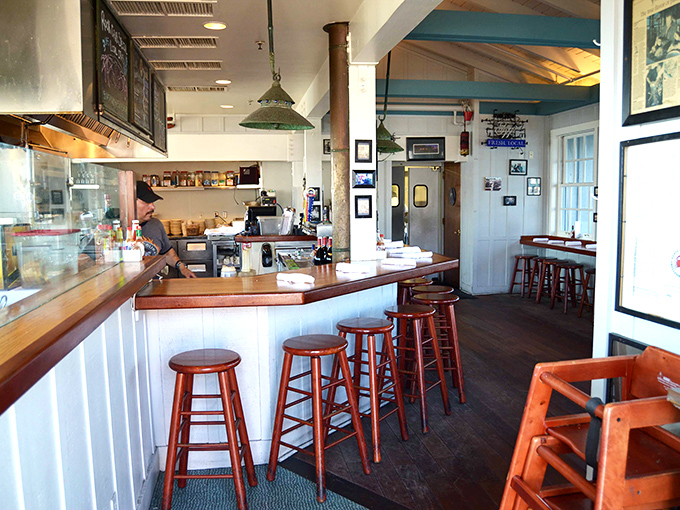 Classic nautical interior where wooden stools and maritime charm create the perfect backdrop for serious seafood.