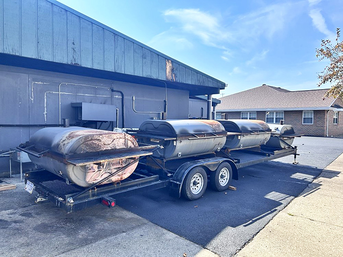 The outdoor smoker brigade&mdash;steel warriors that transform humble cuts into neighborhood legends through the ancient alchemy of smoke and patience.