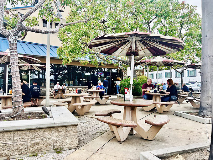Outdoor dining where the ocean breeze provides the ambiance and concrete picnic tables say, "Focus on the food, not the furniture."