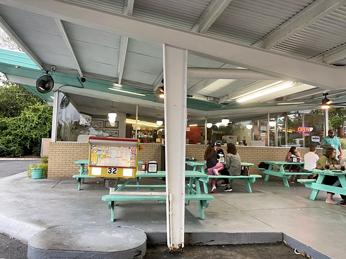 Those turquoise picnic tables aren't just outdoor seating&mdash;they're community gathering spots where summer memories are made. 