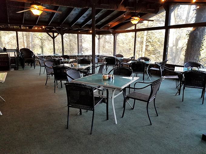 Outdoor seating surrounded by greenery offers a peaceful alternative for those who prefer their steaks with a side of fresh air.