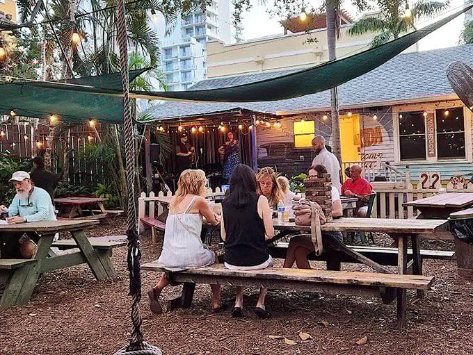 Outdoor dining where the Florida evening air mingles with seafood steam and conversation flows as freely as the drinks.