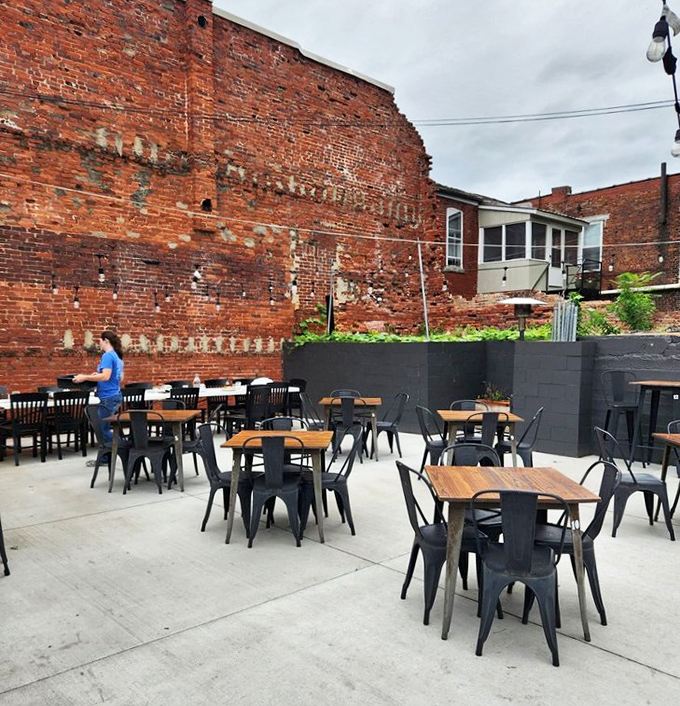 The outdoor patio, nestled against historic brick walls, offers al fresco dining with a side of small-town charm.