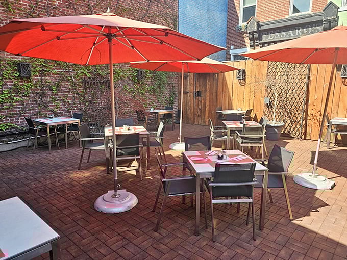 The patio offers an urban oasis where summer breezes complement burger steam in nature's perfect al fresco dining arrangement.