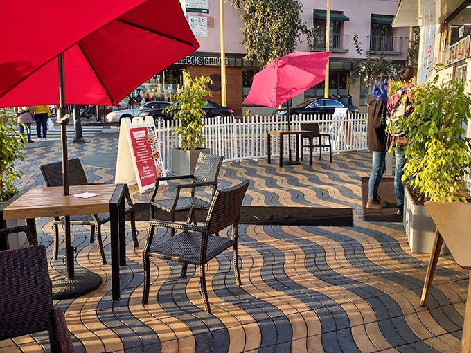 The outdoor patio where ocean breezes enhance every bite. Red umbrellas provide shade while you contemplate another glass of Sauvignon Blanc. 