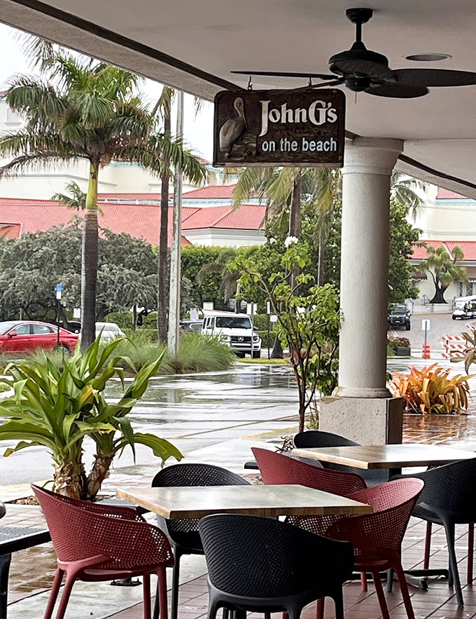 Even Florida rain can't dampen the John G's experience. Those outdoor tables offer a front-row seat to paradise between bites.