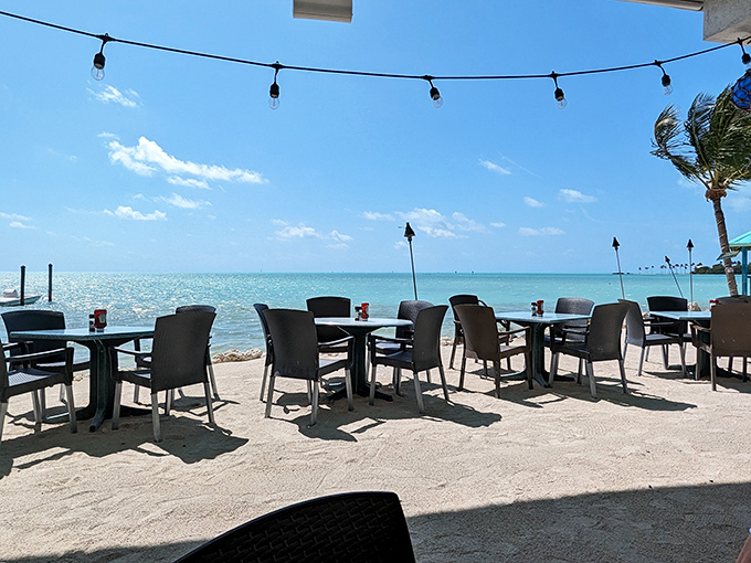 Tables with million-dollar views that don't require reservations months in advance. Just sea, sky, and the gentle reminder that rushing through meals is for landlocked folks.