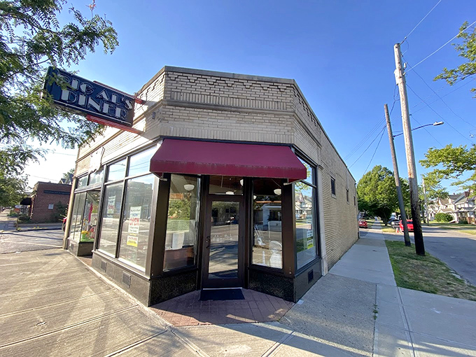 Corner diners like this aren't just restaurants—they're neighborhood landmarks that happen to serve incredible eggs. The morning sun just knows where to shine.