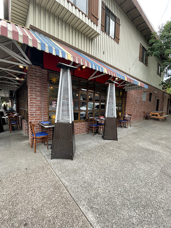 Outdoor dining under colorful awnings - because great Filipino food tastes even better with fresh Portland air.