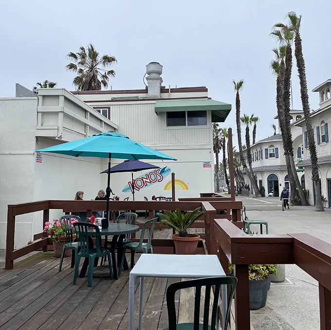 The outdoor patio where breakfast meets ocean air. Palm trees sway as if they're dancing to the rhythm of satisfied munching.