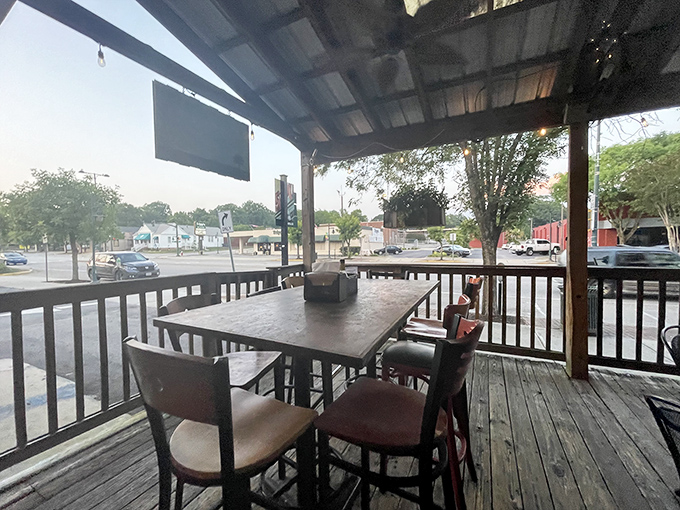The covered porch offers front-row seats to Five Points life, perfect for people-watching while your taste buds have their own adventure.