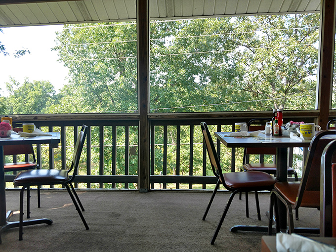 The screened porch offers a view of Missouri greenery &ndash; nature's perfect digestif after a meal that demands to be savored.