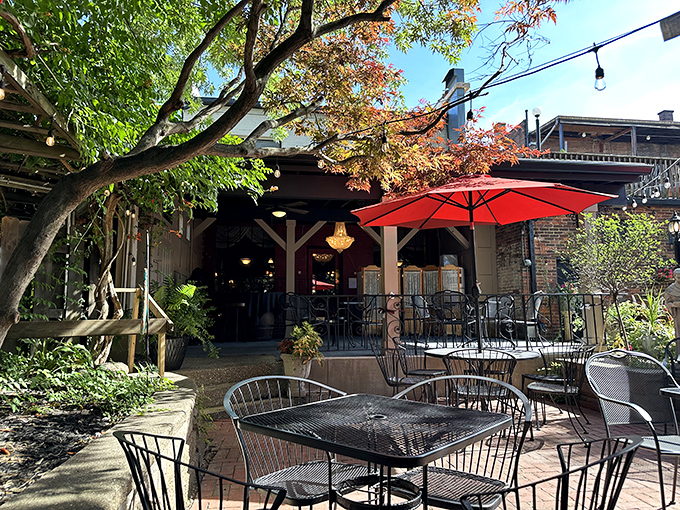 The garden patio offers a leafy escape from urban life &ndash; red umbrellas and wrought iron furniture creating an alfresco oasis in Little Italy.