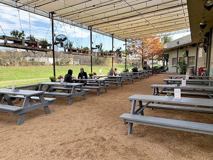 The outdoor patio offers Texas-style dining under the stars, complete with picnic tables and string lights.