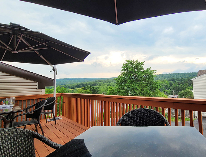 Outdoor deck dining with mountain vistas - because sometimes cowboys need fresh air with their prime rib.