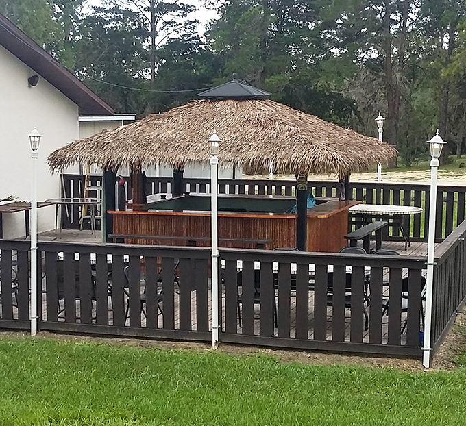 The tiki-style outdoor seating area&mdash;Florida's answer to the question "How can we make eating barbecue even more vacation-like?"