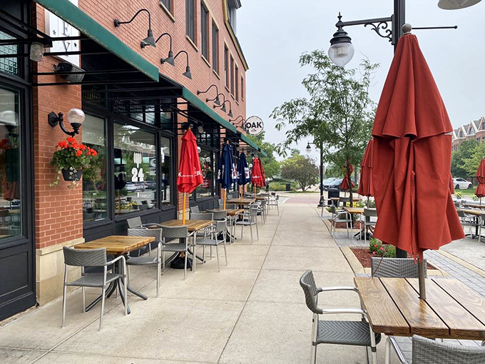 The outdoor seating area offers a front-row seat to Glenview life, where red umbrellas stand ready to shield diners from everything except food envy from passersby.