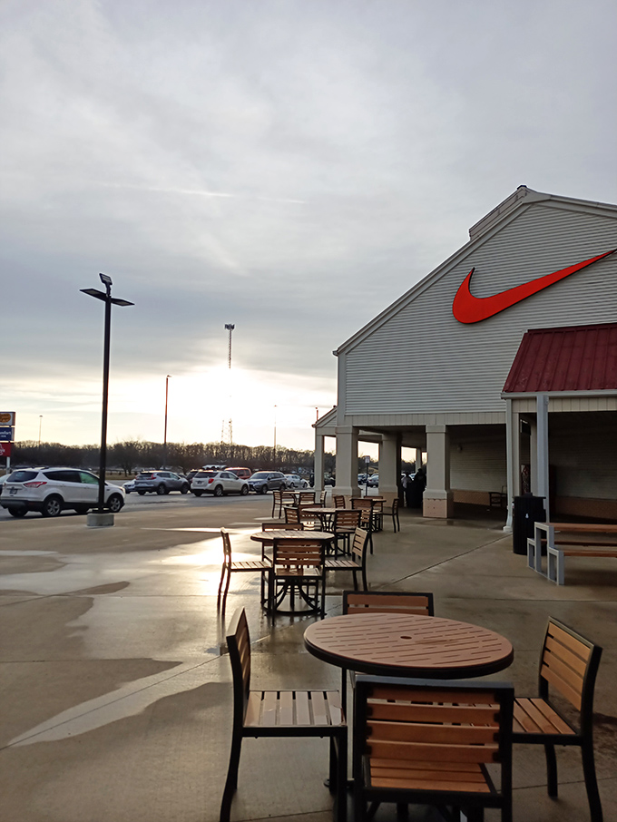 Outdoor seating areas provide strategic resting zones for weary shoppers to regroup, refuel, and plan their next retail conquest.