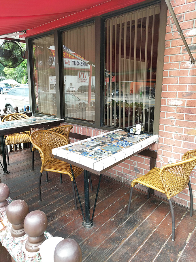 Outdoor seating with charming mosaic tables&mdash;where Florida's weather and Three Coins' cooking create the perfect dining alliance.
