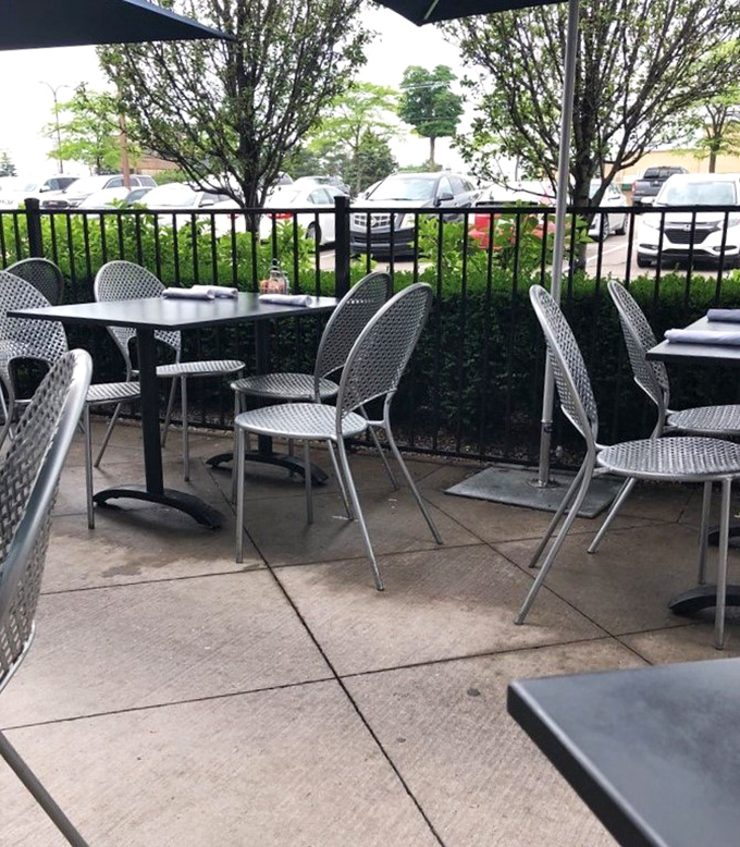 The outdoor patio offers fresh air dining surrounded by greenery&mdash;Michigan summers were made for moments like this.