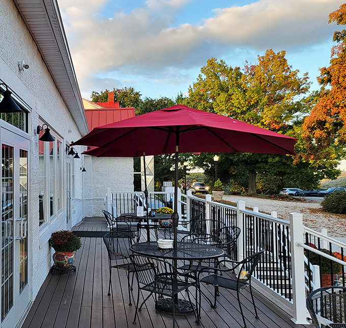 Autumn magic on the deck &ndash; where crisp air, falling leaves, and that signature red umbrella create the perfect setting for outdoor dining.