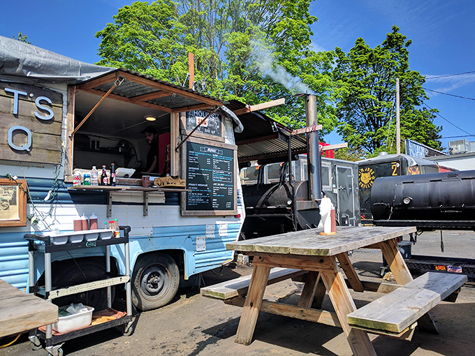 On sunny Portland days, this outdoor setup becomes the hottest real estate in town. The smoke signals say "come hungry, leave happy."