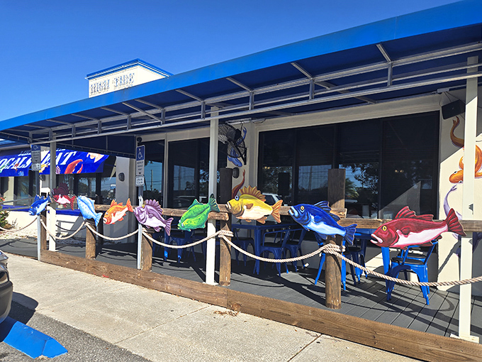 Outdoor seating guarded by a colorful school of wooden fish &ndash; like sentinels ensuring only the seafood-worthy may pass through these hallowed doors.
