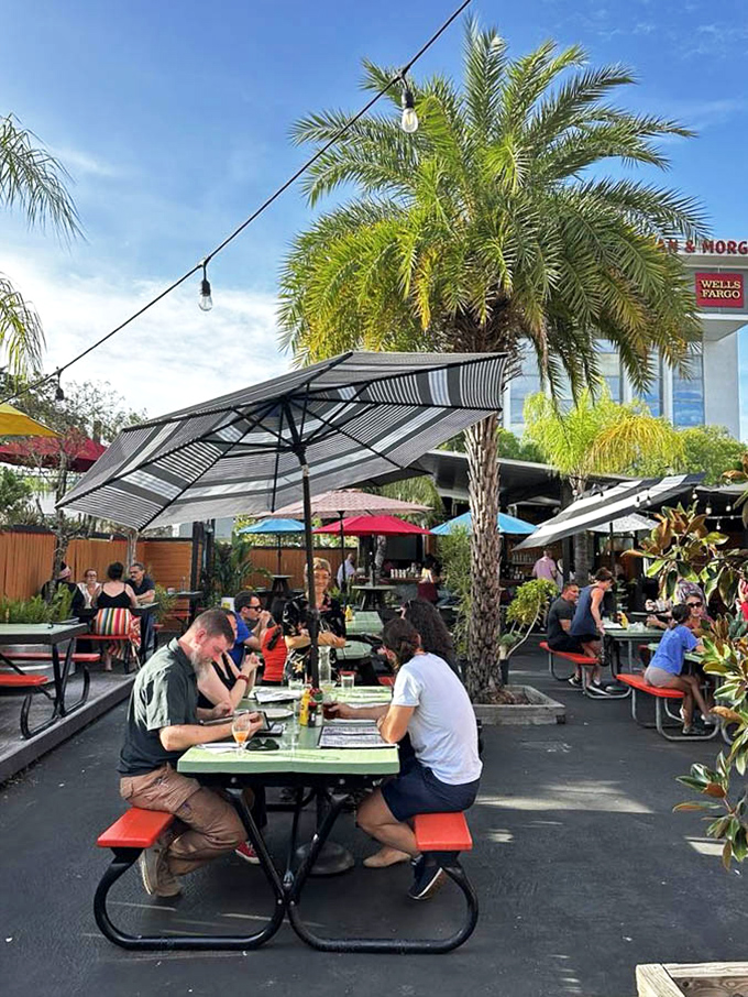 The outdoor patio offers Florida sunshine with a side of people-watching &ndash; palm trees included at no extra charge.