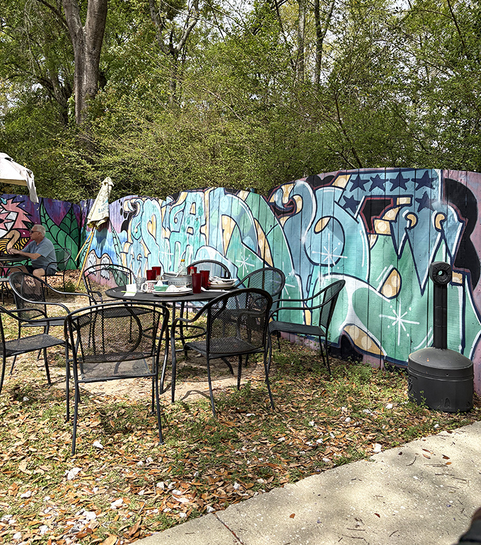 The outdoor seating area where graffiti art meets garden party &ndash; only in Tallahassee, friends.