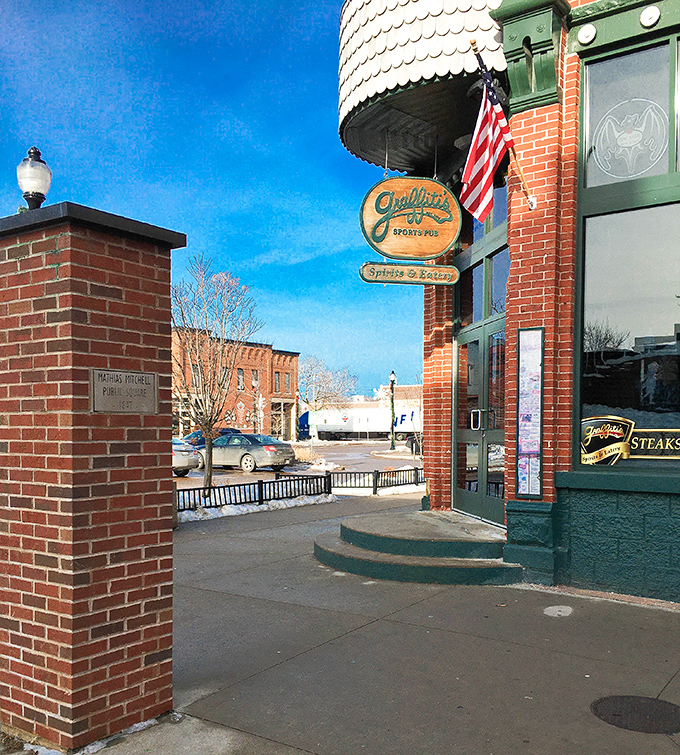 The wooden sign swinging gently outside promises "Sports & Spirits"—two things Graffiti's delivers with the same reliability as a Rodgers-to-Adams touchdown connection.