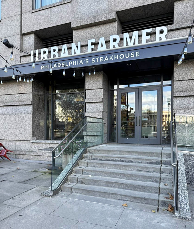 Urban Farmer's exterior signage makes a bold statement against the building's stone facade&mdash;a modern beacon for those seeking serious steak satisfaction.