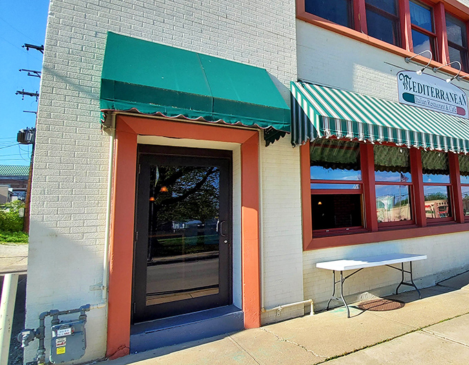 The unassuming entrance belies the flavor explosion waiting inside, proving once again that books and restaurants should never be judged by covers.